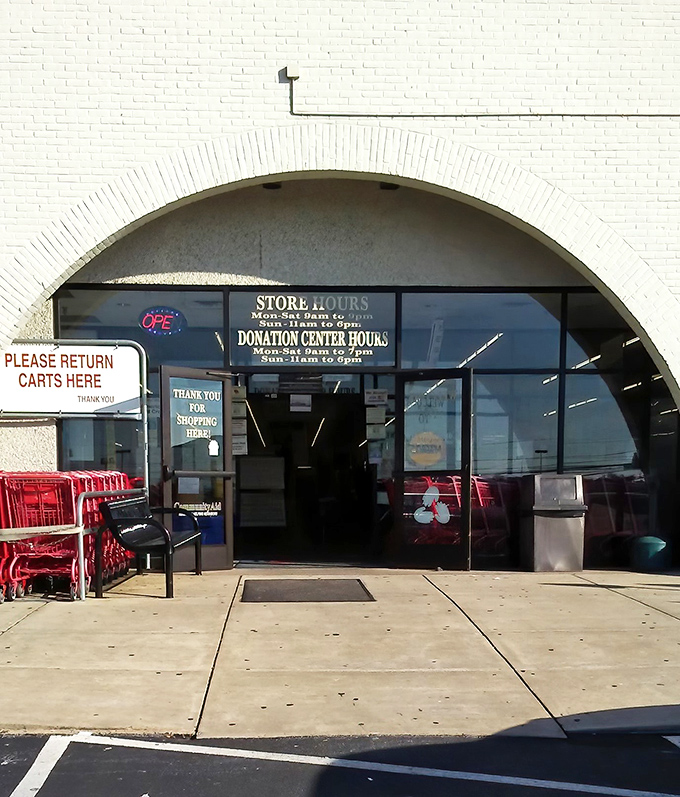 Store hours posted clearly for the dedicated thrifters who plan their week around fresh inventory drops and colored tag sales.