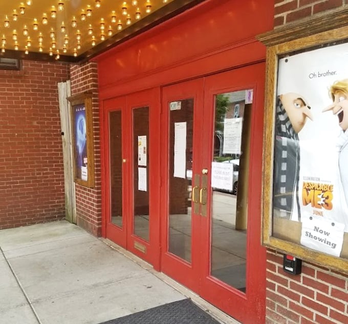 Those vibrant red doors aren't just an entrance; they're a time portal to when going to the movies was an event, not just another Tuesday night activity.