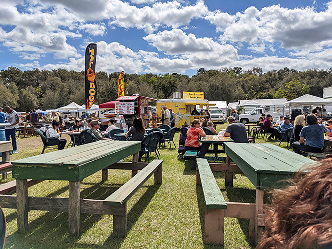 Florida's version of an outdoor food court comes with picnic tables, hot dog stands, and the kind of cloud-scattered sky that makes you forget you're shopping.