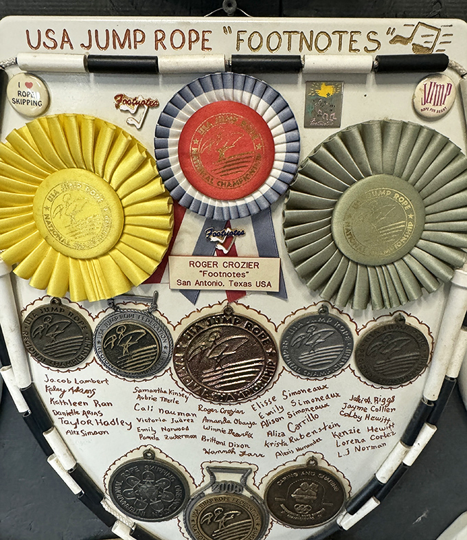 Jump for joy! This toilet seat celebrates the "Footnotes" jump rope team with ribbons, medals, and meticulous documentation of championship achievements.