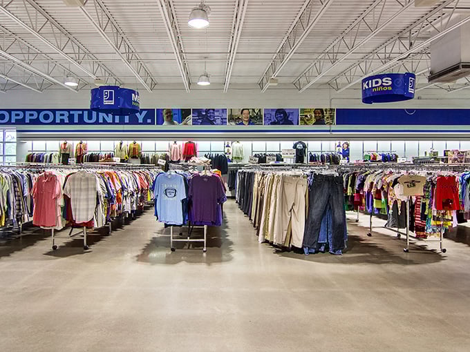Rows upon rows of meticulously organized clothing create a rainbow of possibilities. Each garment waits patiently for its second chance at fashion glory.