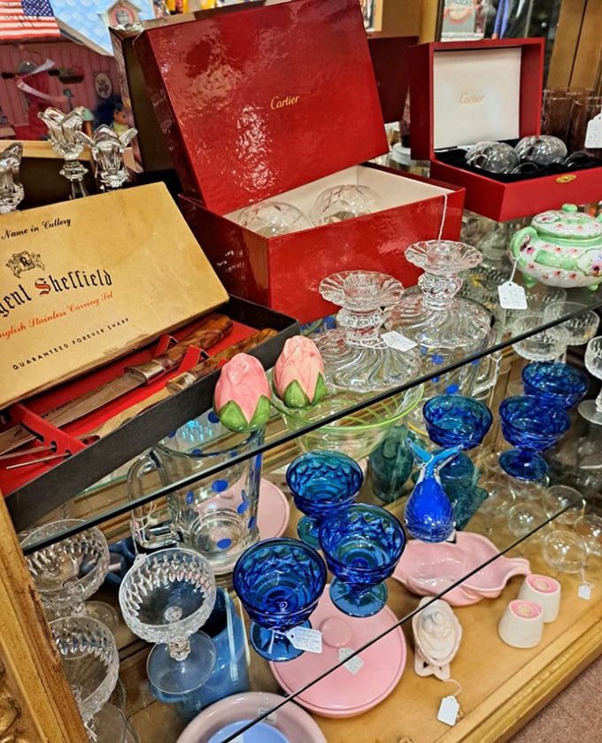 These aren't just drinking vessels &ndash; they're liquid jewels. Cartier boxes and Sheffield cutlery sharing space with cobalt blue goblets that practically sing in the light. 