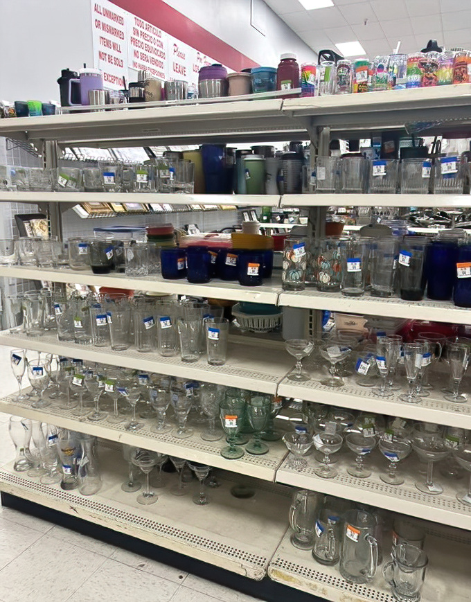 Glassware galore! From mid-century modern tumblers to quirky shot glasses, each shelf tells stories of dinner parties past.