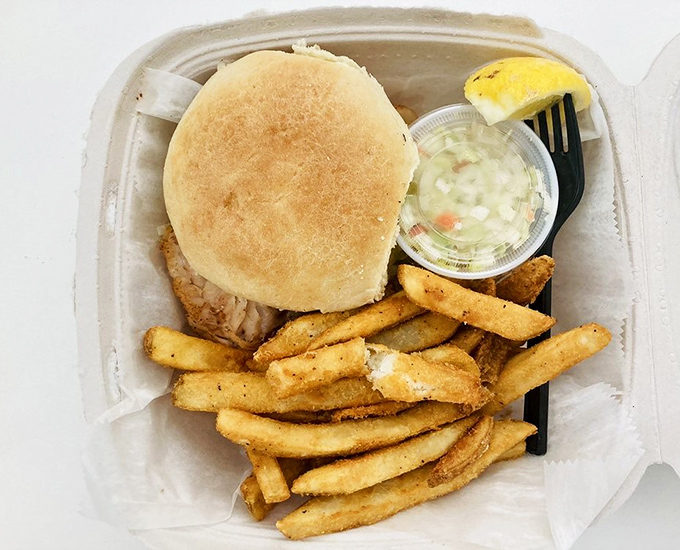 The star of the show arrives! This grouper sandwich with crispy fries is Florida's edible sunshine &ndash; simple, satisfying, and worth every mile driven.