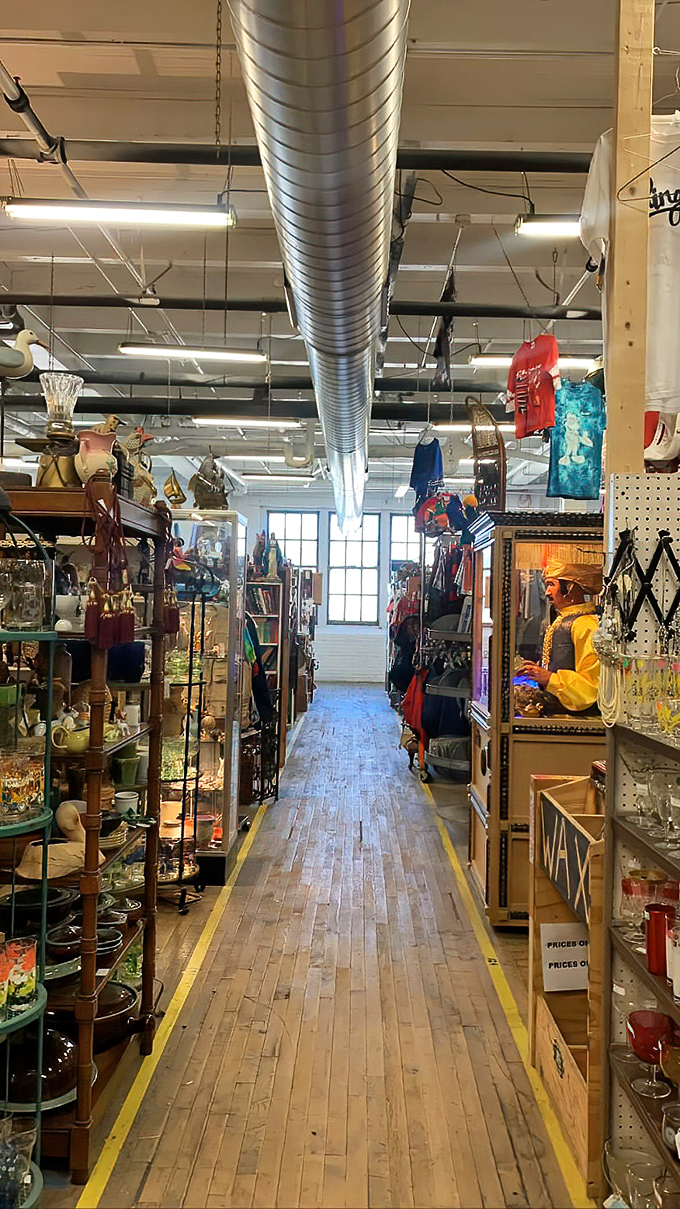 Yellow-lined wooden pathways guide you through this labyrinth of memories, where exposed ductwork watches over decades of American design history.