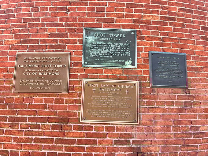 History etched in bronze tells the tower's tale. These plaques are like CliffsNotes for architecture buffs—concise, informative, and zero chance of a pop quiz.