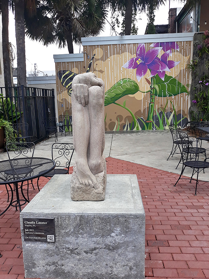 Art and nature collaborate in this courtyard, where sculpture meets vibrant murals in Ocala's thriving cultural scene.