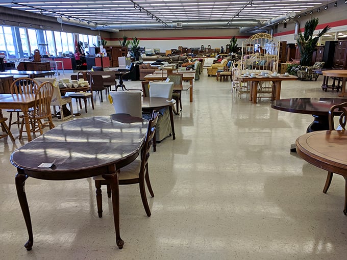 Dining table heaven! Row after row of polished wood tables and chairs await new homes, like an adoption center for furniture that needs love.