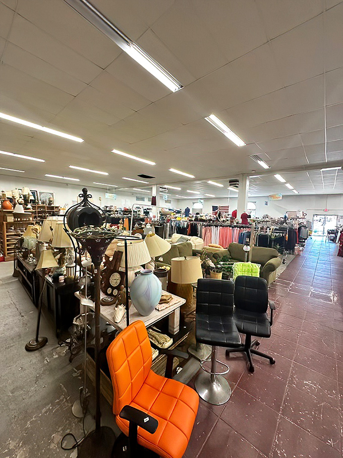 A wonderland of possibilities unfolds inside, where orange chairs and vintage lamps stand ready for their second act in someone's home story.