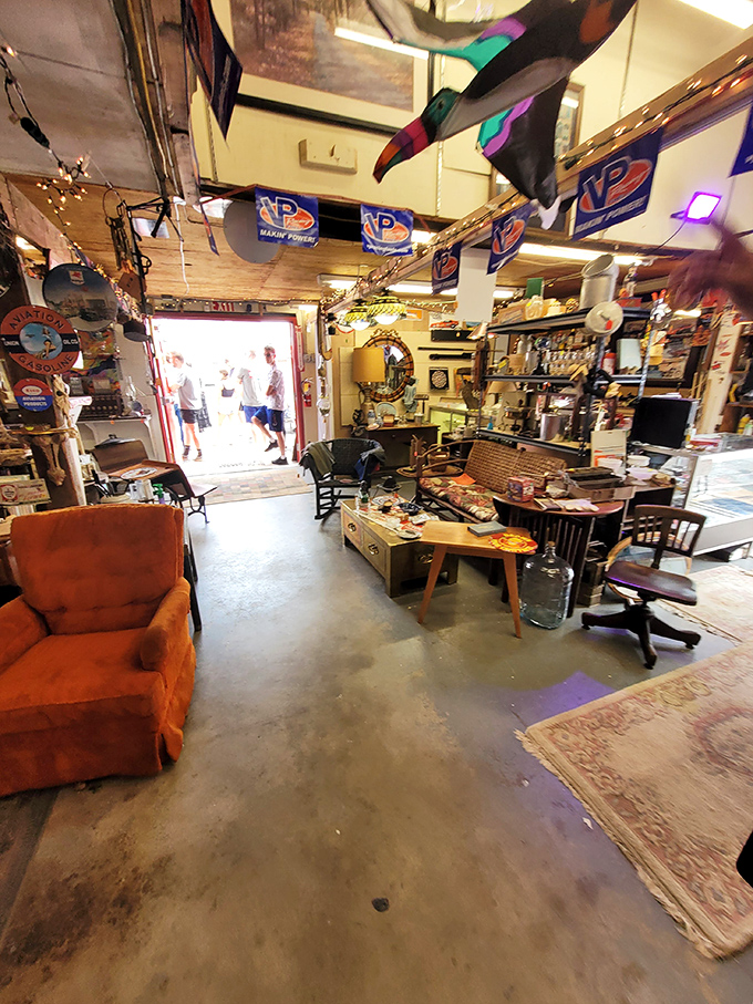 Every nook and cranny tells a story in this vendor's booth, where vintage signs and well-loved furniture create a time capsule you can walk through.