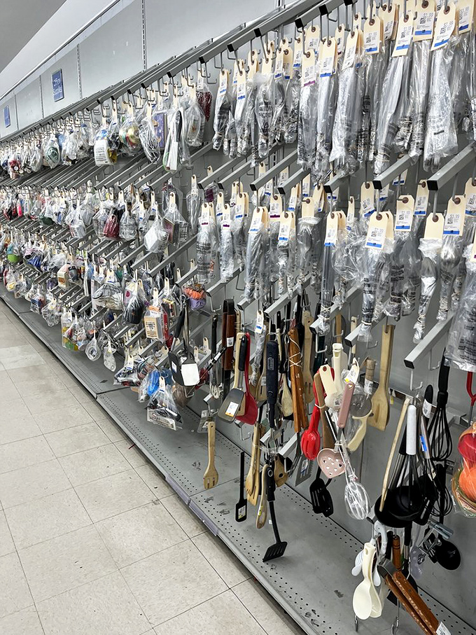 Kitchen gadgets hang like culinary jewelry, each promising to solve a cooking problem you didn't even know you had. Julia Child would have needed a U-Haul.