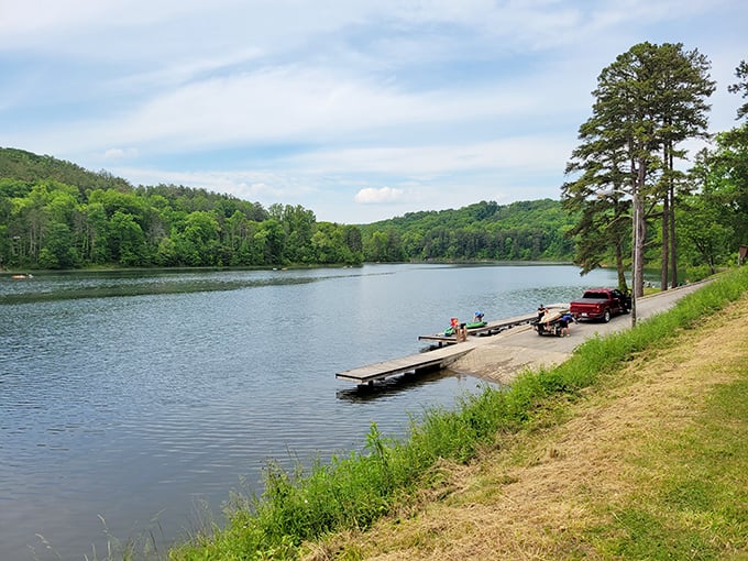 Simple pleasures: a wooden dock invites adventure on Lake Hope, where boats wait patiently like eager puppies ready for their next outing.