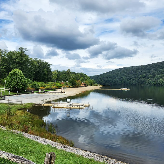 Summer serenity at its finest. The boat dock extends like an invitation to adventure, while those mountains stand guard over your peaceful escape.