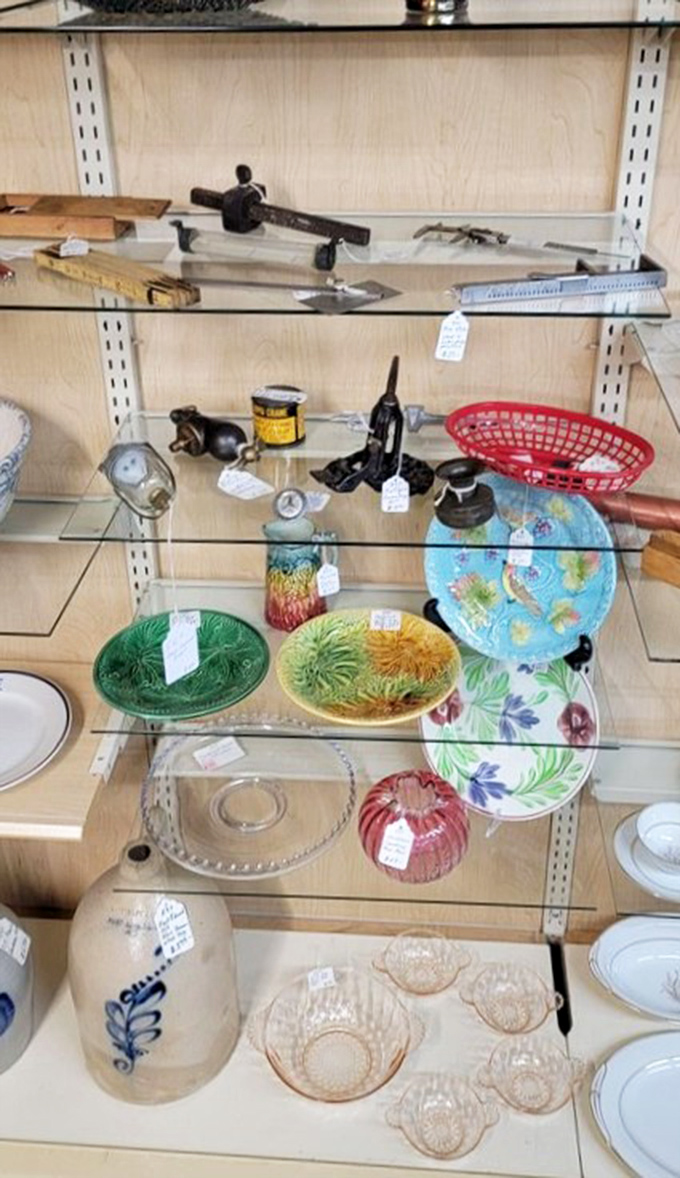 Colorful majolica plates and vintage glassware await new homes. Each piece whispers tales of Sunday dinners and holiday celebrations from decades past.