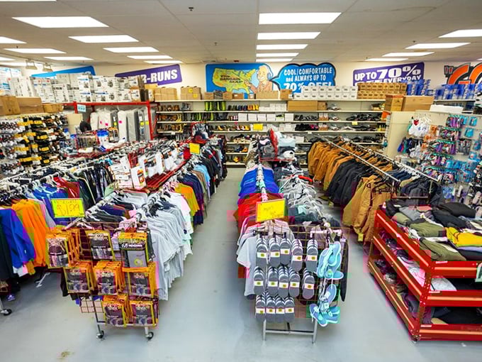 The clothing section at Ollie's isn't just racks &ndash; it's a color-coded expedition through brand names that somehow escaped their usual price tags.