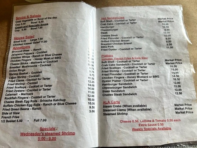 This well-worn menu tells the real story: decades of Delaware seafood tradition captured on a single sheet of paper.