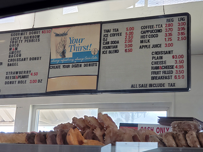 The menu board speaks the universal language of comfort: simple offerings, classic flavors, and Thai tea that locals swear by.