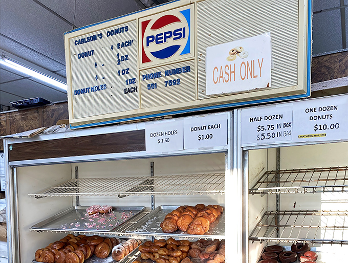That vintage menu board is a time machine to when donuts cost pocket change and Pepsi was the beverage of champions. Cash only&mdash;some traditions never change.