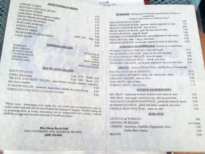 The menu reads like a love letter to Midwest comfort food, where cheese curds rightfully claim their place at the top of the appetizer hierarchy.