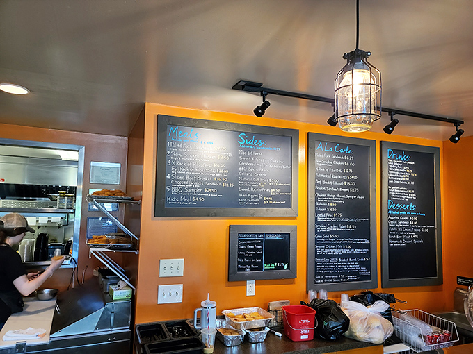 The menu board reads like a love letter to smoked meats, each option more tempting than the last.