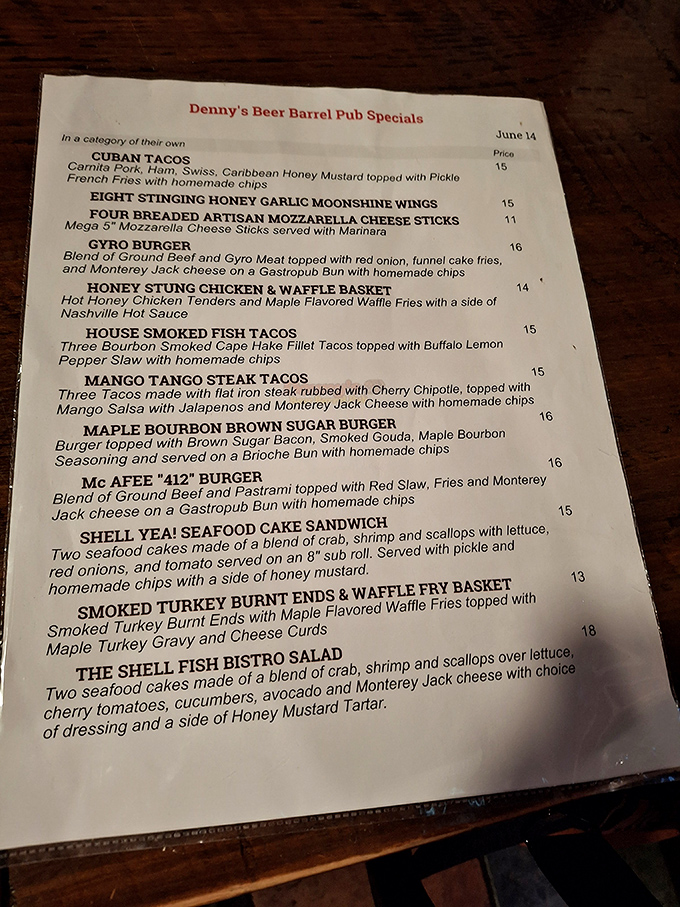 A menu that reads like a foodie's fever dream, where Cuban tacos and maple bourbon burgers share space with honey-stung chicken and seafood delights.