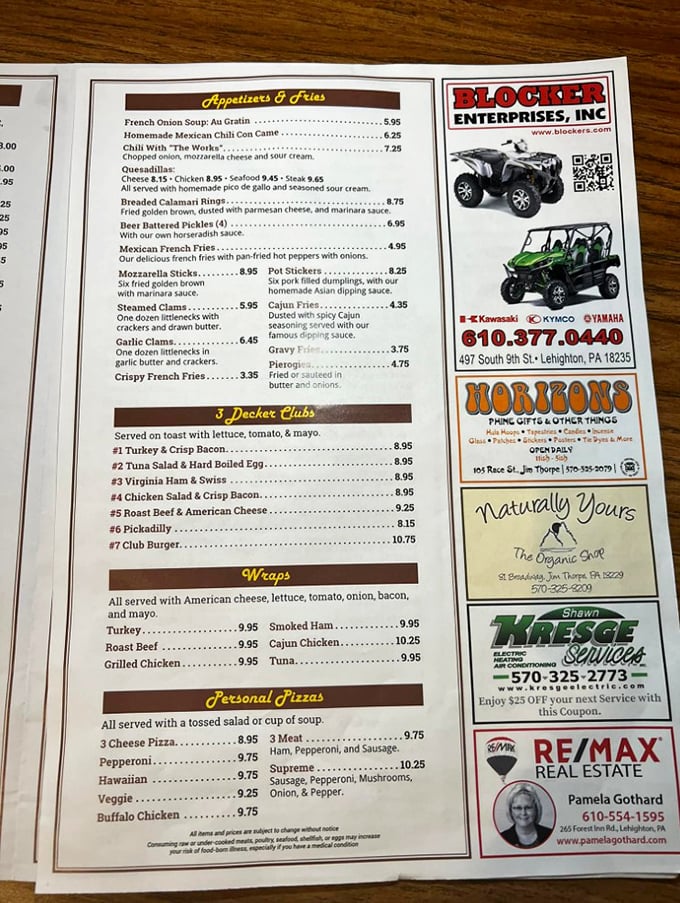 A menu that reads like a greatest hits album of American comfort food, with local businesses proudly advertised in the margins.