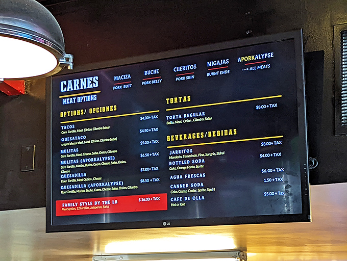The menu board reads like a pork lover's dream journal. Each option promises a different textural adventure in the carnitas universe.