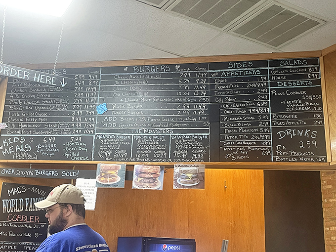 That chalkboard menu tells more stories than a small-town librarian. Notice the "Over 29,916 burgers sold" humble brag in the corner.