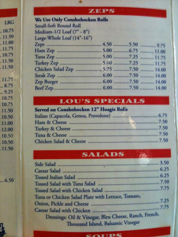 The menu board reveals Lou's secret weapon: Conshohocken rolls, the regionally revered bread that elevates their legendary Zep sandwiches.
