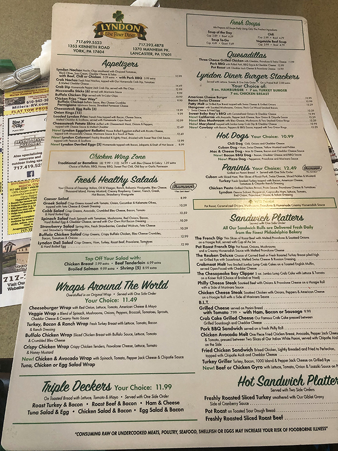 
A menu that requires both hands and serious contemplation. From Triple Deckers to "Wraps Around The World," decision paralysis has never been so delicious.