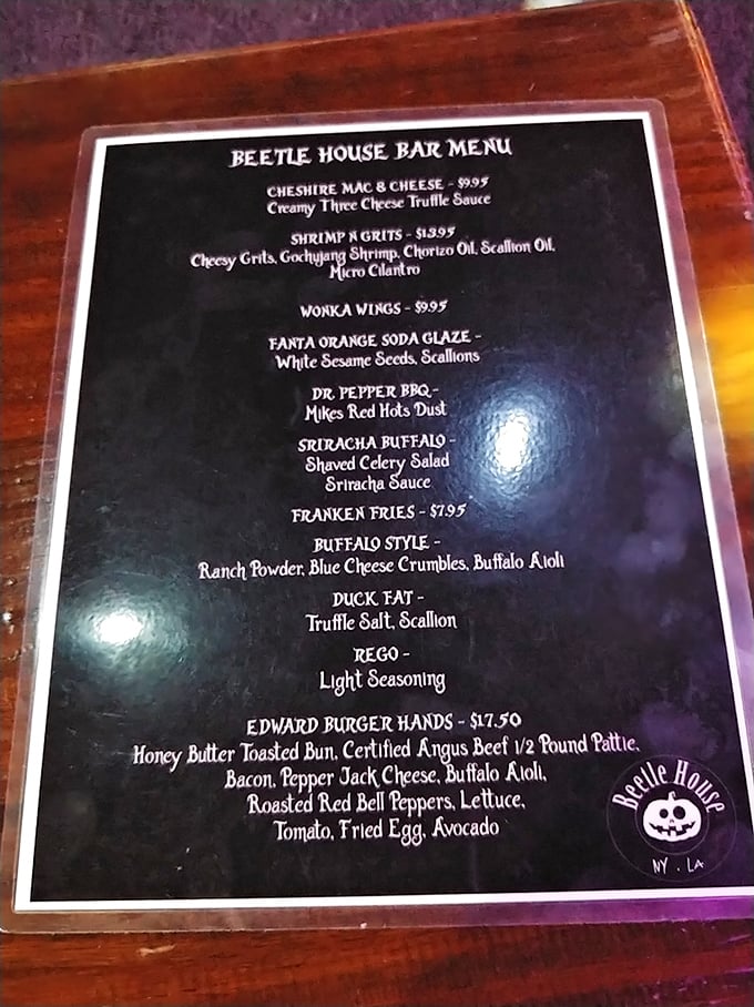 This isn't your average bar menu. "Edward Burger Hands" and "Wonka Wings" prove food can be as theatrical as the setting itself.