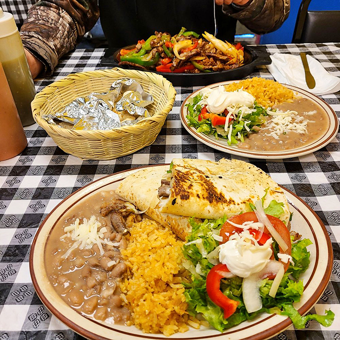 The holy trinity of Mexican comfort: sizzling fajitas, golden quesadillas, and refried beans that make you question everything you thought you knew about legumes.