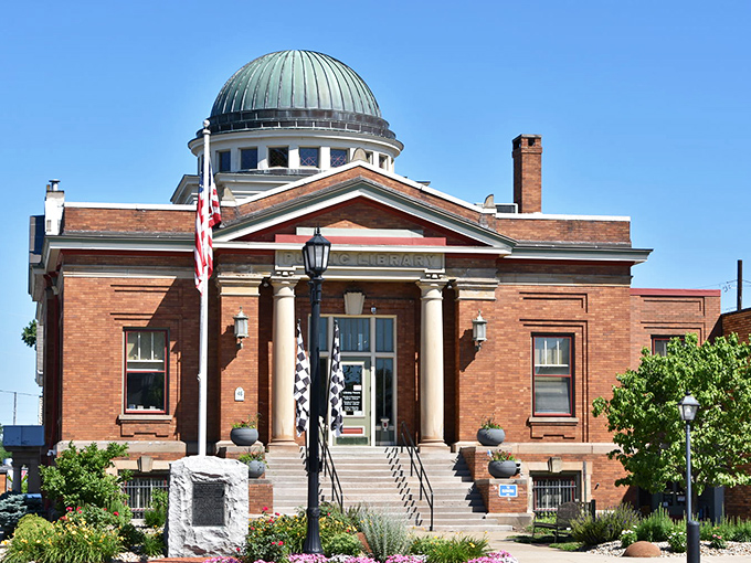 The public library stands proud with its distinctive green dome, a testament to an era when public buildings were designed to inspire.