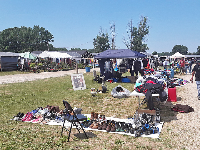 The heartbeat of Paw Paw on market day. Shoes lined up like hopeful contestants, clothing fluttering in the breeze, and shoppers on the eternal quest.