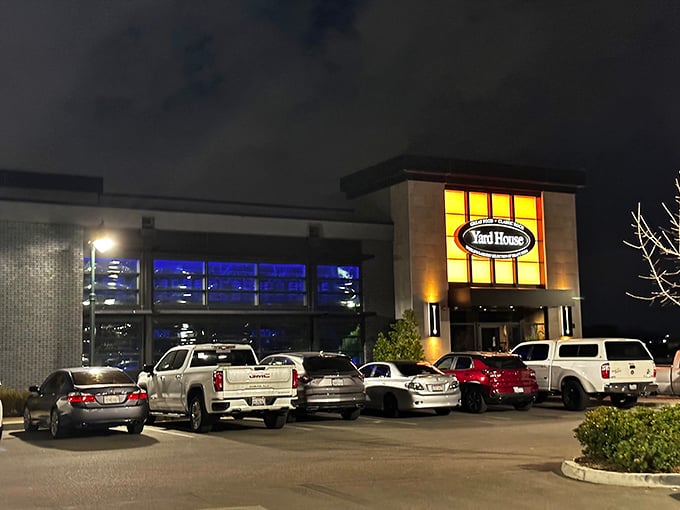 The Yard House's warm glow beckons hungry patrons after sunset&mdash;a reminder that good food doesn't need ocean views to satisfy the soul.