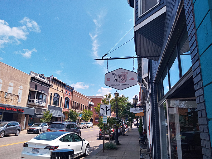 The Cider Press beckons hungry travelers with its inviting sign. Inside awaits the kind of meal that makes you text friends: "Cancel dinner plans. Found heaven." 