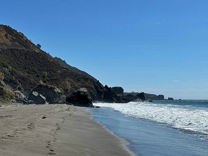 Where rocky cliffs stand guard over sandy shores. Mother Nature's version of "you can look, but don't touch."