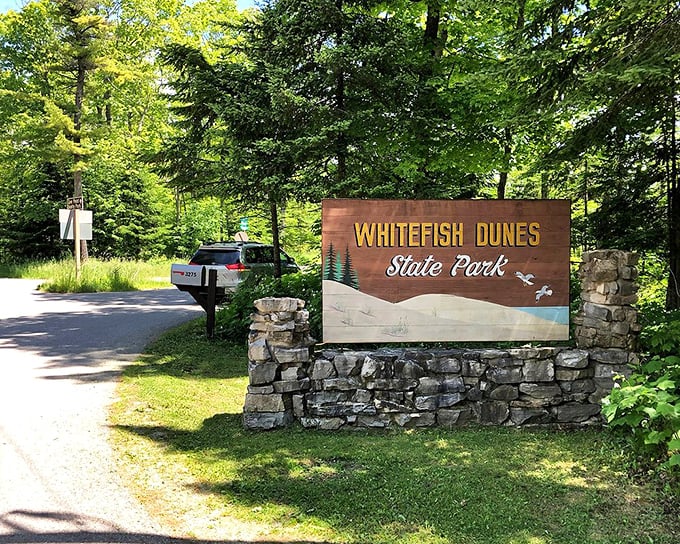 The gateway to Wisconsin's sandy paradise. This rustic sign marks the transition from ordinary life to a world where dunes, not deadlines, command your attention.