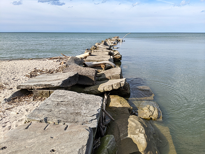Nature's breakwater stretches into Lake Erie like a rocky runway, inviting adventurous souls to venture just a bit further.