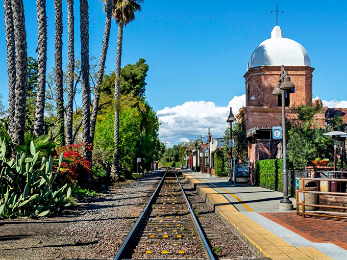 All aboard for yesteryear! The historic train station's bell tower stands watch as modern travelers follow paths blazed by Spanish missionaries.