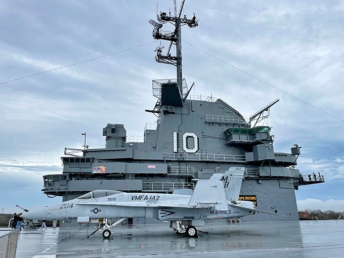 The USS Yorktown welcomes visitors with stars and stripes, standing tall as the centerpiece of Patriots Point. Walking this gangway feels like stepping into a time machine.