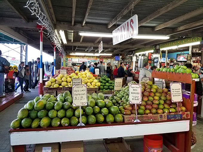 Nature's color wheel on full display. Those mangoes aren't just stacked&mdash;they're practically posing for their tropical fruit yearbook photo. 