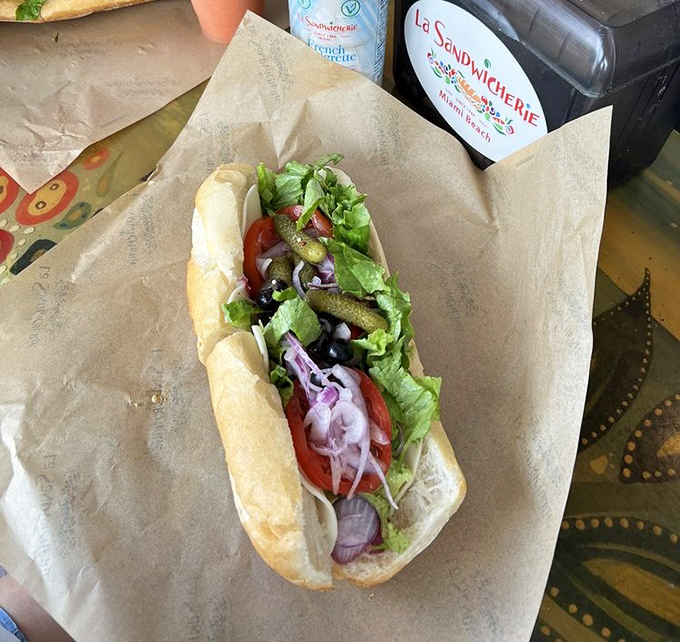 Behold the humble baguette transformed into an edible work of art. Those vibrant veggies aren't just toppings; they're the supporting cast in a culinary blockbuster.