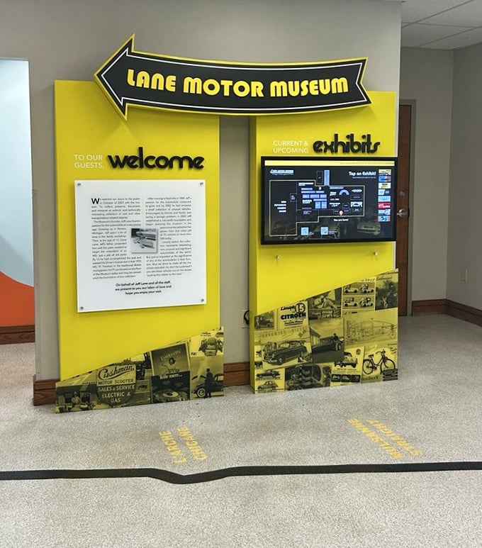 The museum's cheerful yellow welcome area promises automotive adventures ahead, like the opening credits to your favorite road trip movie.