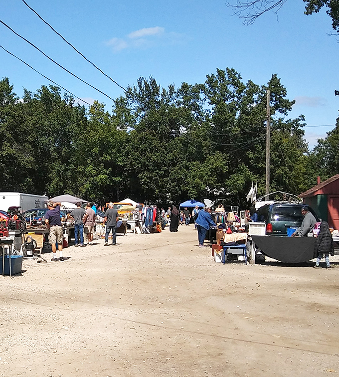 Main Street, flea market edition&mdash;where shoppers stroll gravel pathways between tables laden with possibilities and vendors ready with stories behind every item.