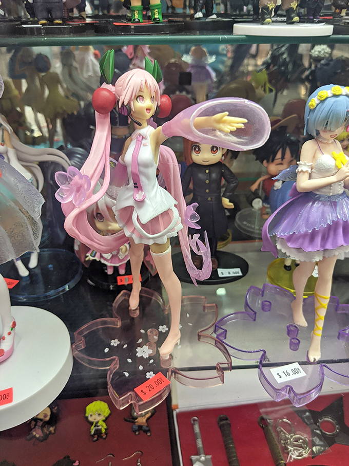 Anime figurines stand in silent, colorful formation, a paradise for collectors. These detailed characters bring Japanese pop culture to life in the heart of Orange County.