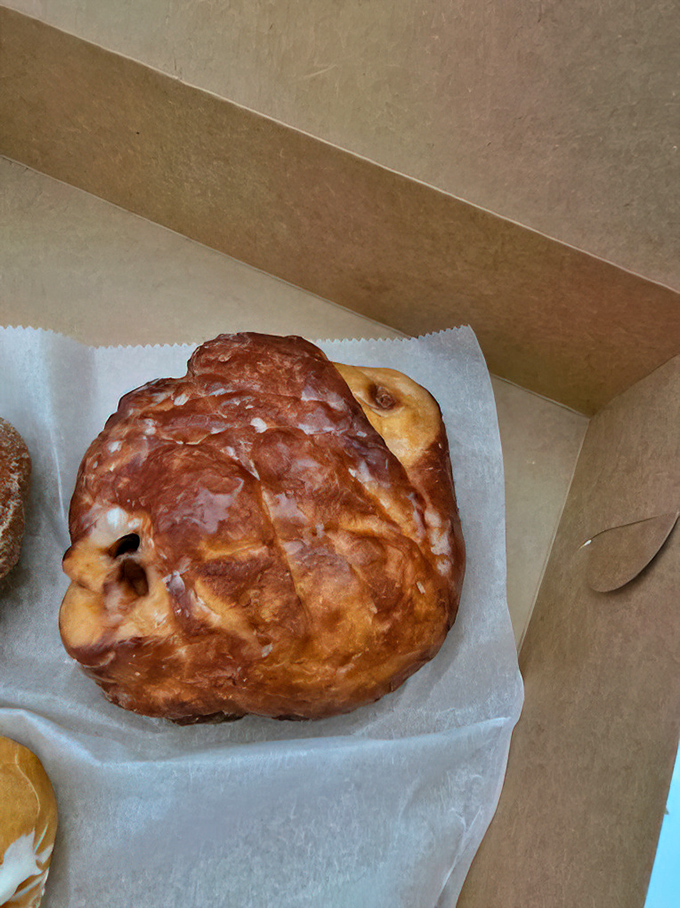 Behold the golden masterpiece that launched a thousand road trips - Donald's famous apple fritter.