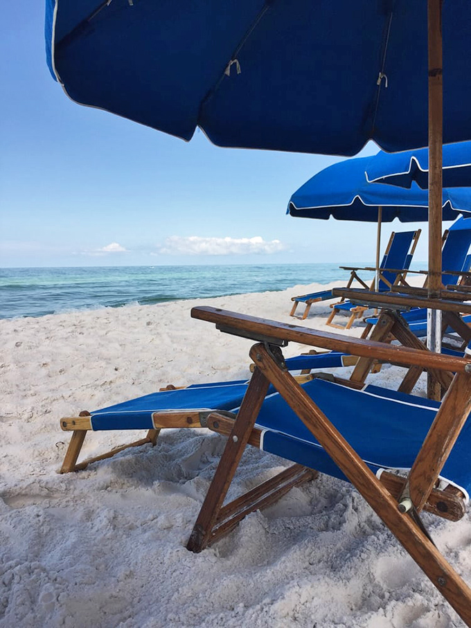 The unofficial Seagrove office setup&mdash;wooden chairs, azure umbrellas, and the world's most spectacular view. No TPS reports required.
