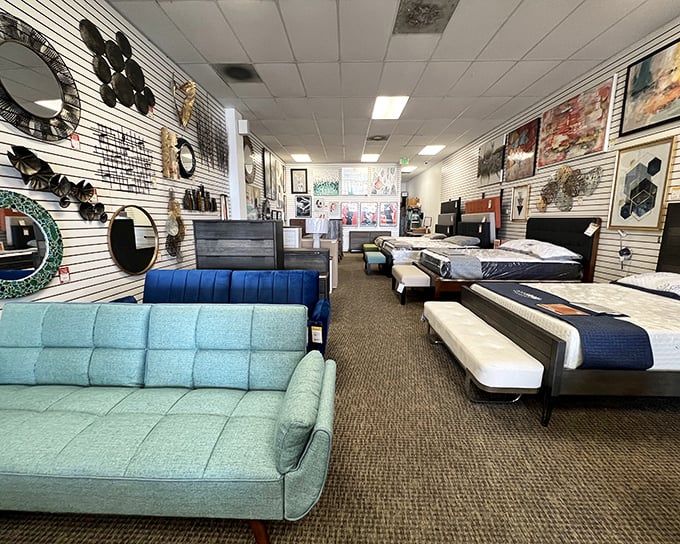 Mid-century modern meets contemporary comfort in this bedroom vignette. That turquoise sofa is practically begging to star in your next Instagram post.