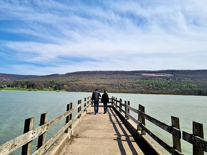 Some paths are best walked together. This weathered boardwalk invites contemplative strolls where conversation flows as naturally as the water beneath.